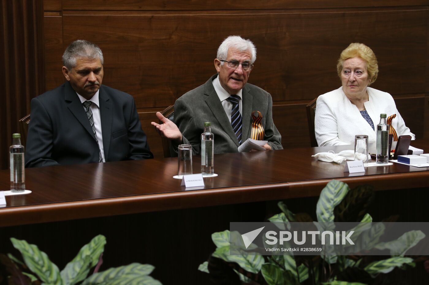 Jean-Claude and Micheline Mague present family heirloom to parents of ...