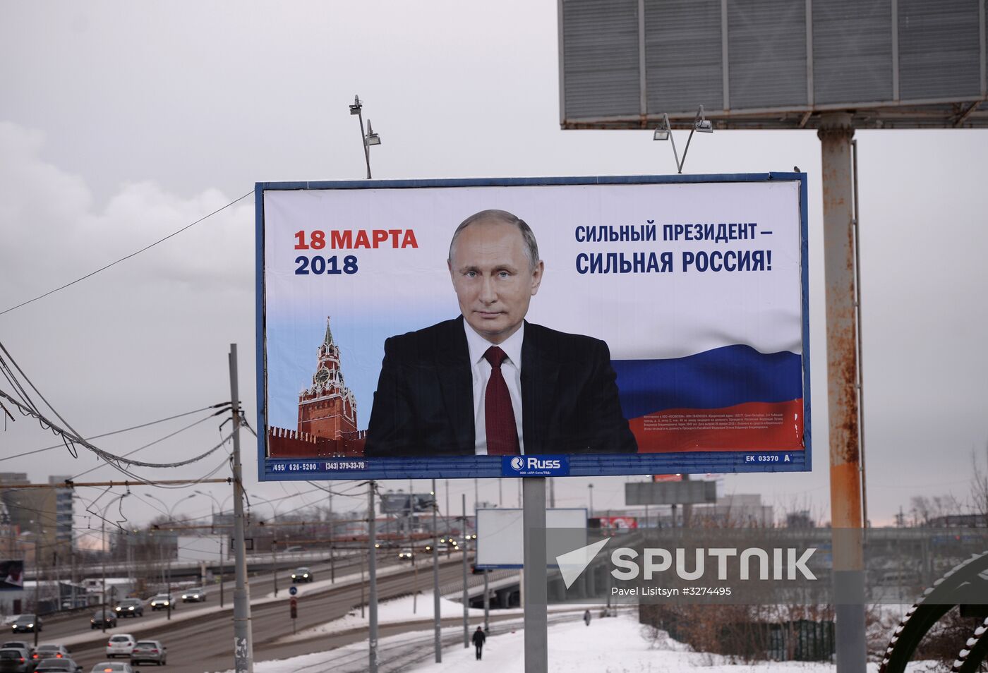 Campaign posters in support of incumbent Russian President Vladimir ...